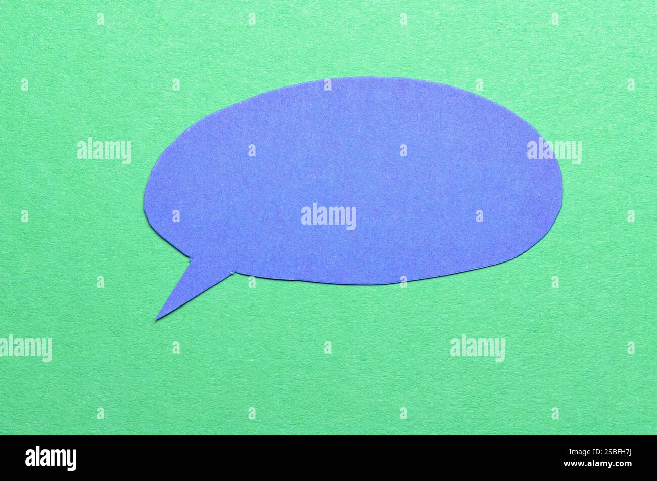 Blue cut out blank paper speech bubble of round shape with copy space ...