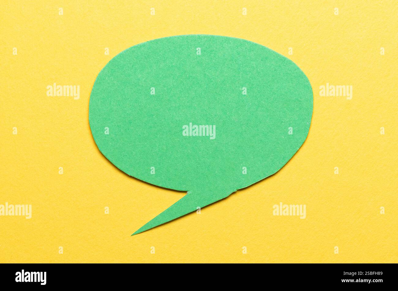 Green cut out blank paper speech bubble of round shape with copy space ...
