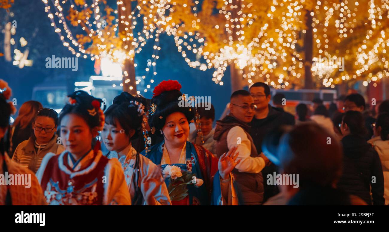 Beijing, China. Pretty Women In Traditional Chinese Dresses Walking At ...