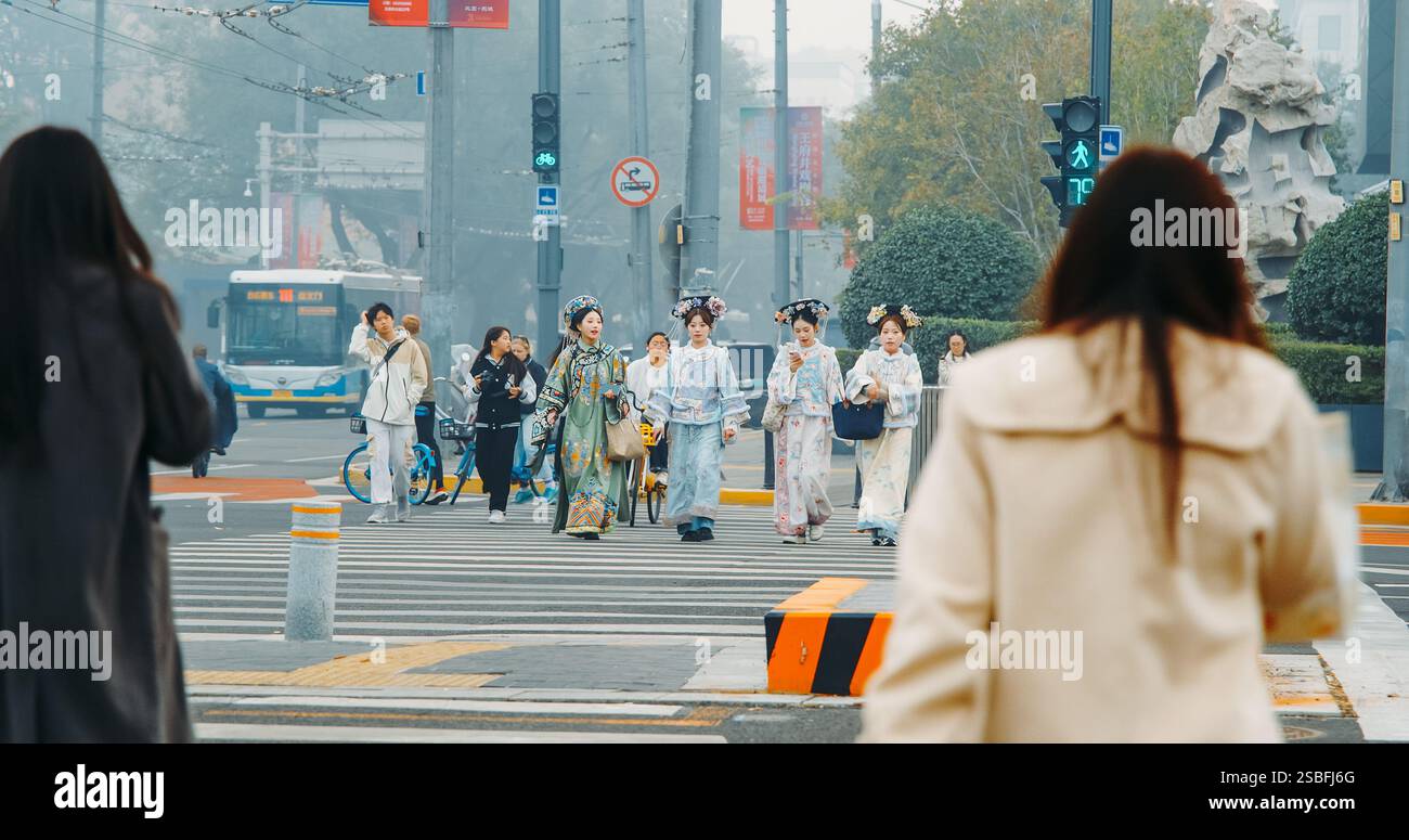 Beijing, China. Pretty Girls In Traditional Chinese Dresses Walk Along ...
