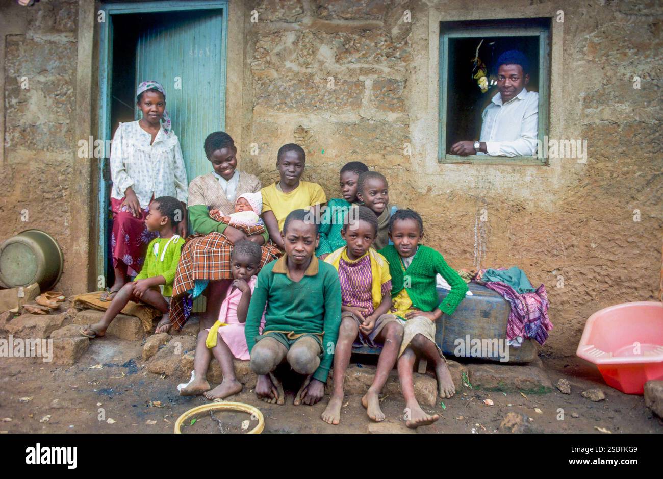 Kenya, Nairobi, large family in front of their house in a city slum ...