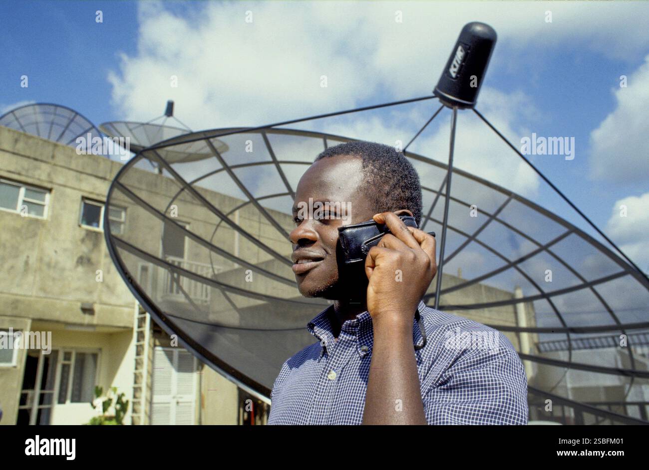 Kenya, Nairobi, an employee of the internet company Kenya Web uses his ...