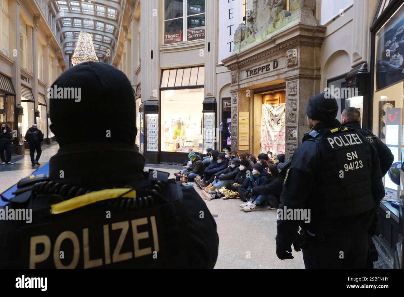 Leipzig, Germany. 03rd Feb, 2025. Police officers observe activists ...