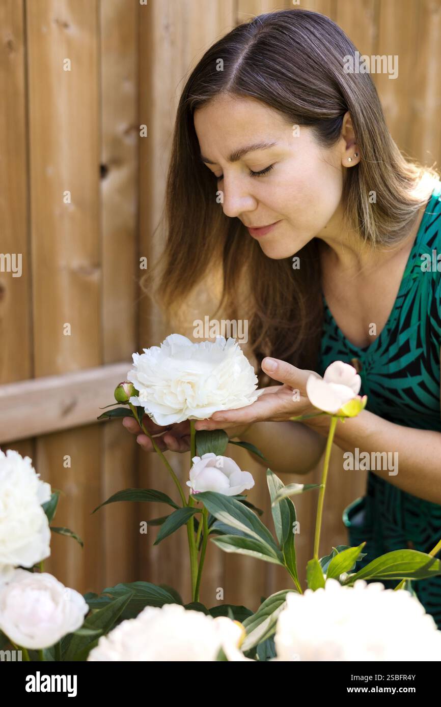 Woman smelling fresh blooming hi-res stock photography and images - Alamy