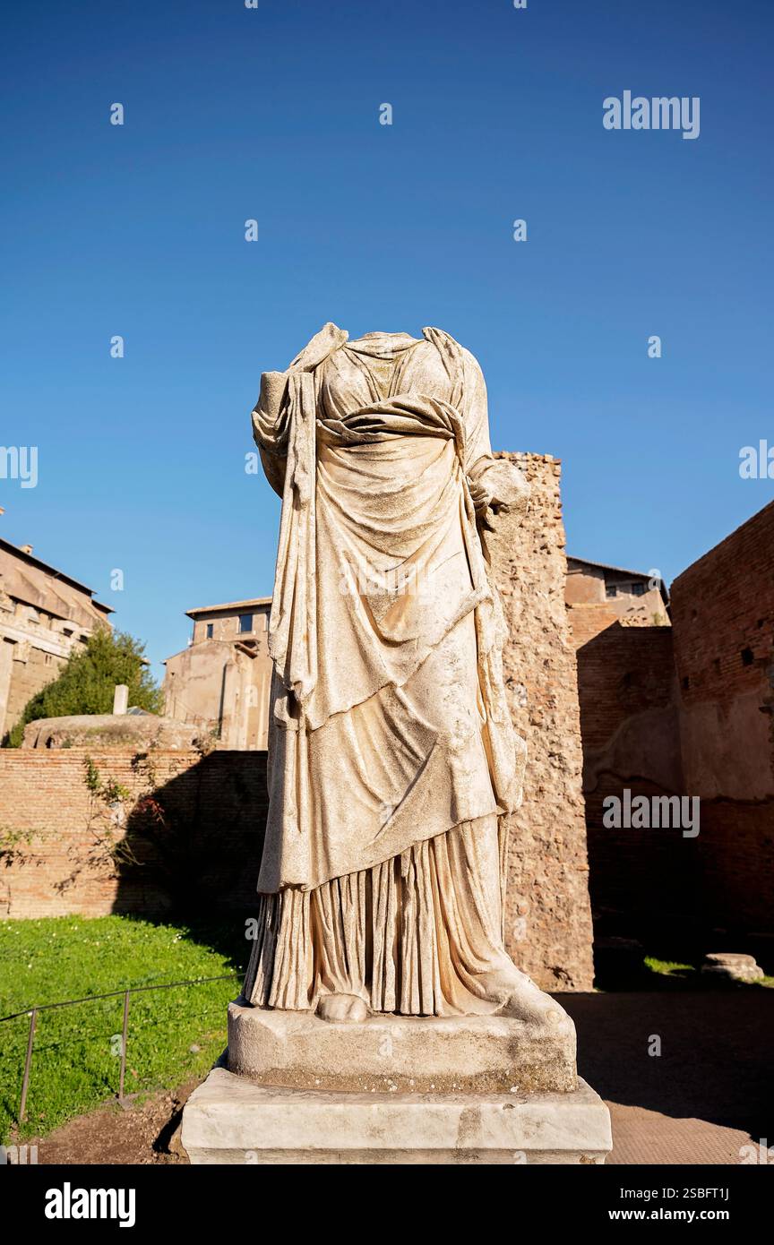 Headless ancient Roman marble statue with draped clothing in ruins ...