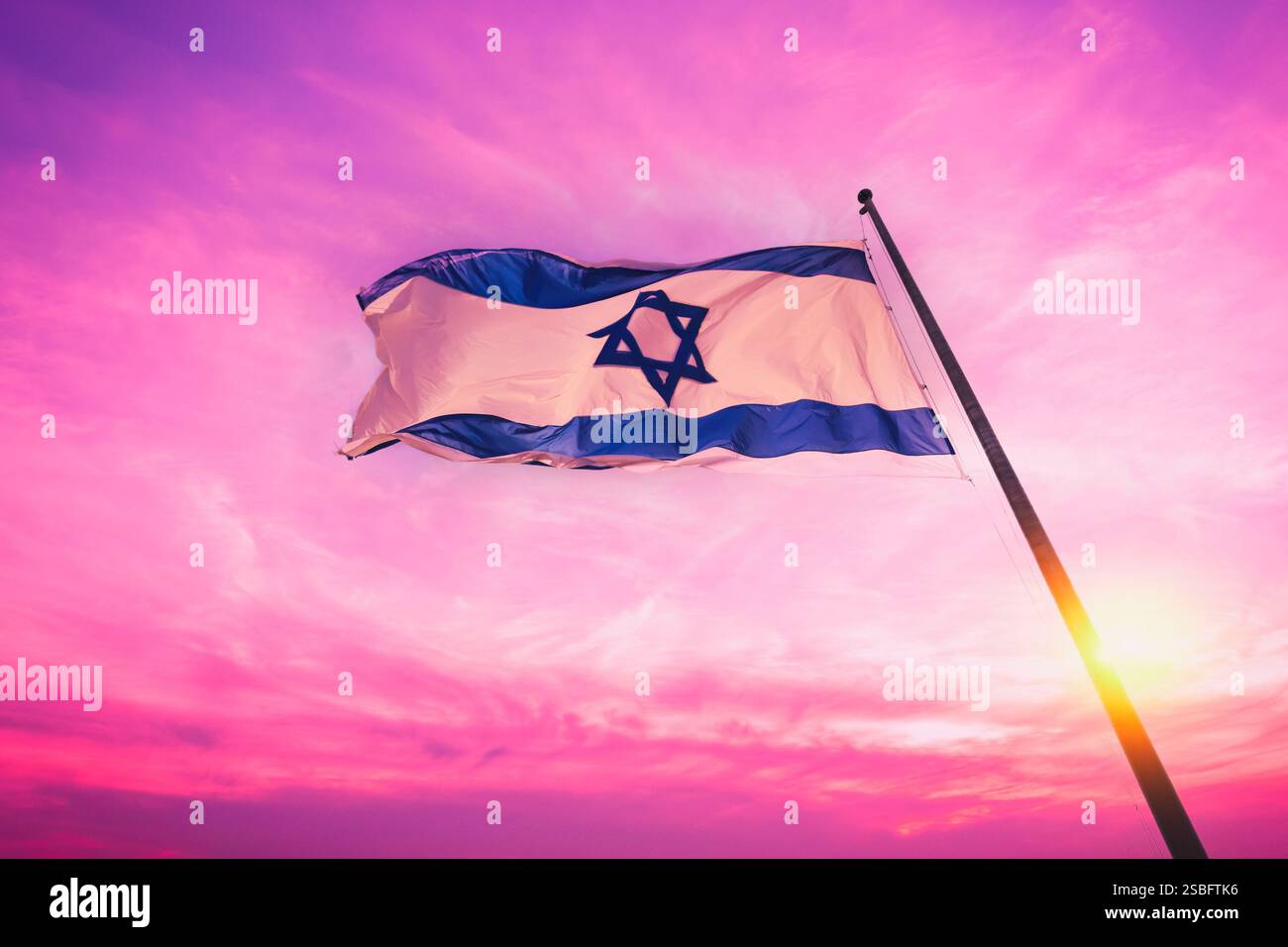 Flag of Israel fluttering against pink sunset sky Stock Photo - Alamy