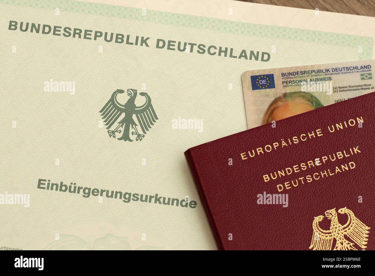German passport and identity card on the naturalization certificate ...
