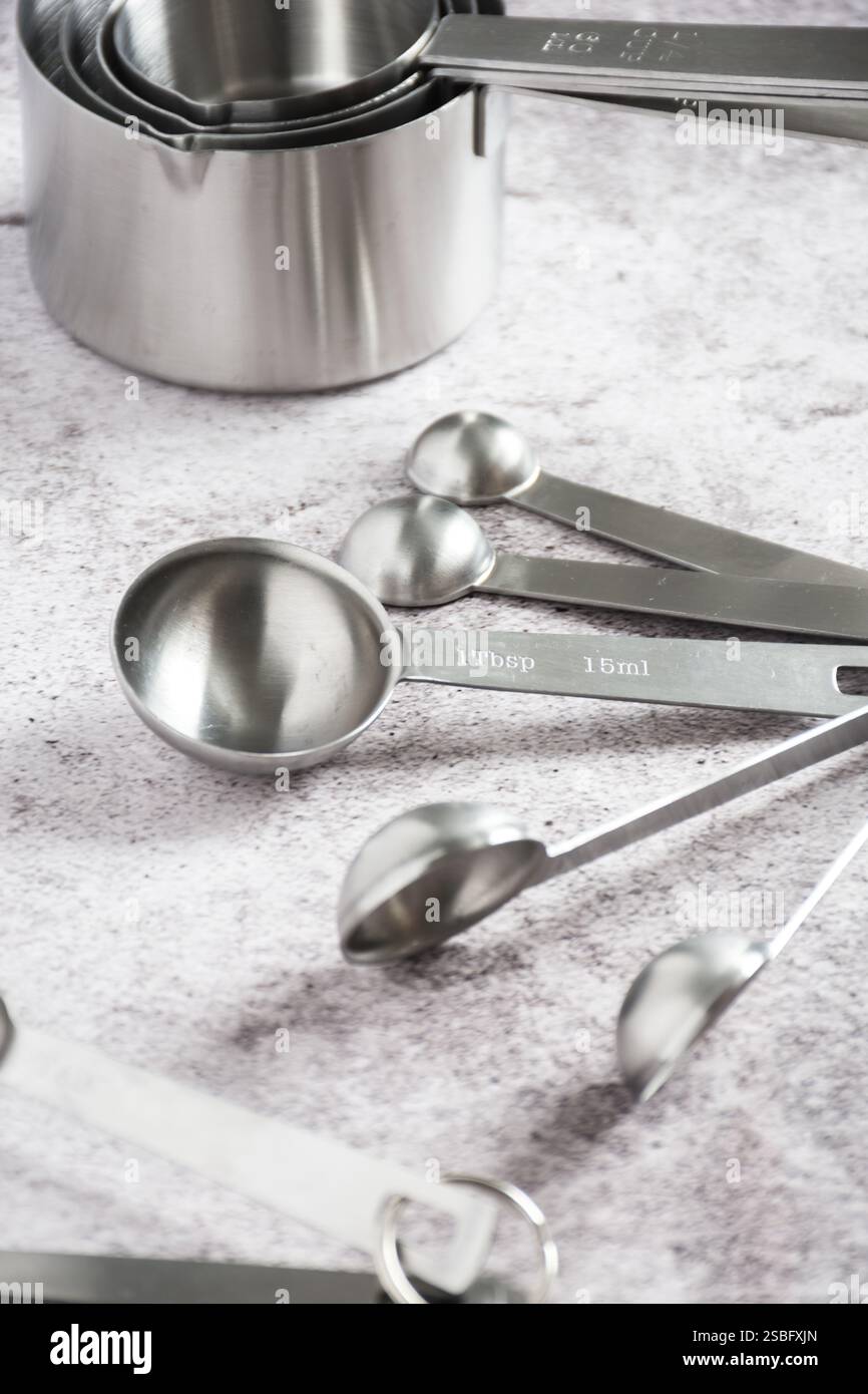 measuring spoons and cups displayed Stock Photo - Alamy