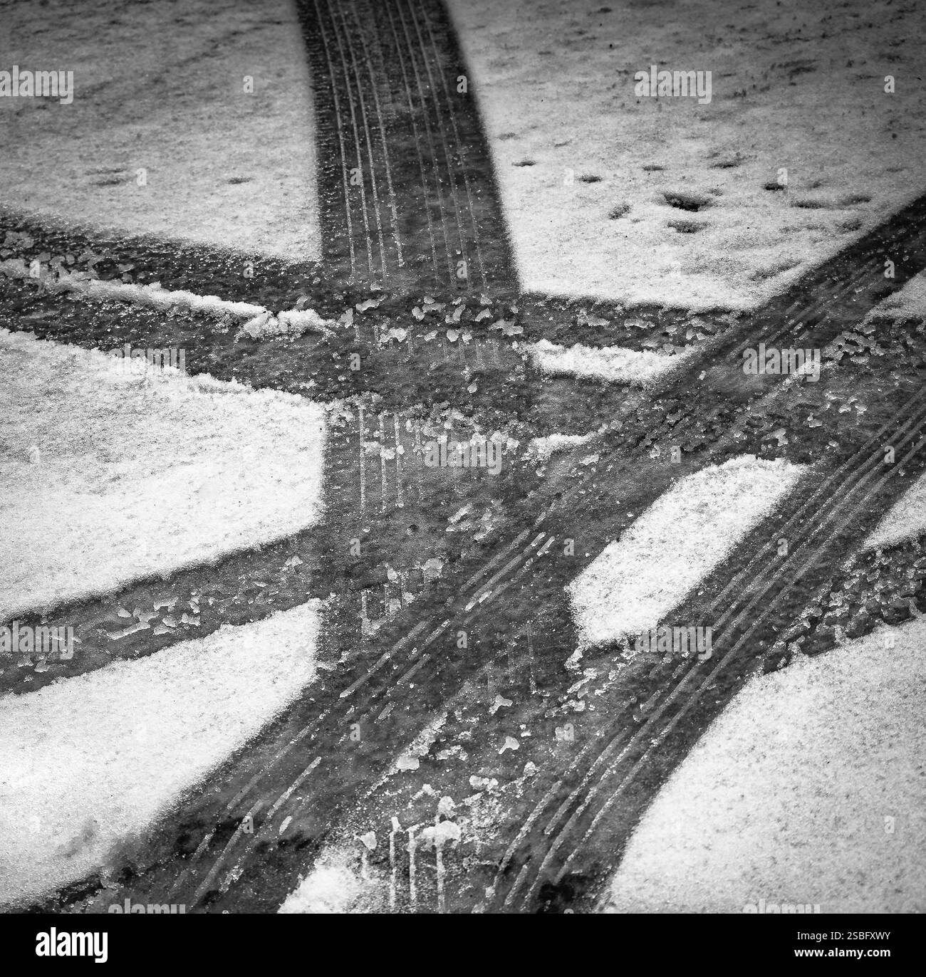 Tire tracks in the snow making an abstract criss-cross pattern Stock ...