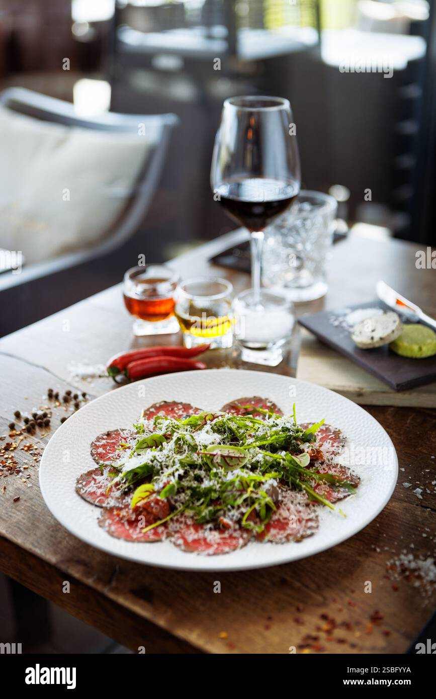 Beef carpaccio. Borettane onion, sun-dried tomato, truffle dressing ...