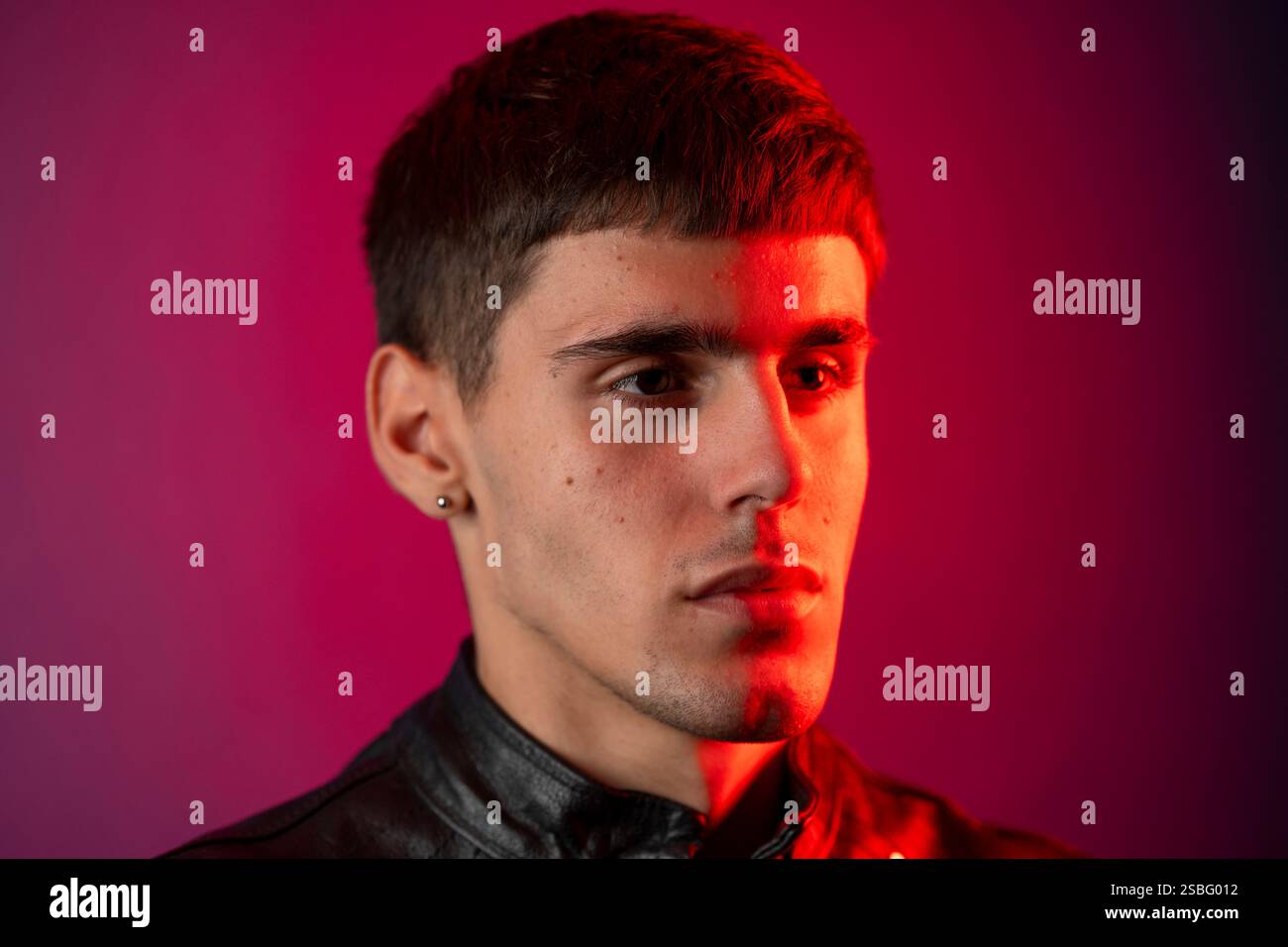 Model posing with dramatic lighting during fashion photoshoot, showing ...