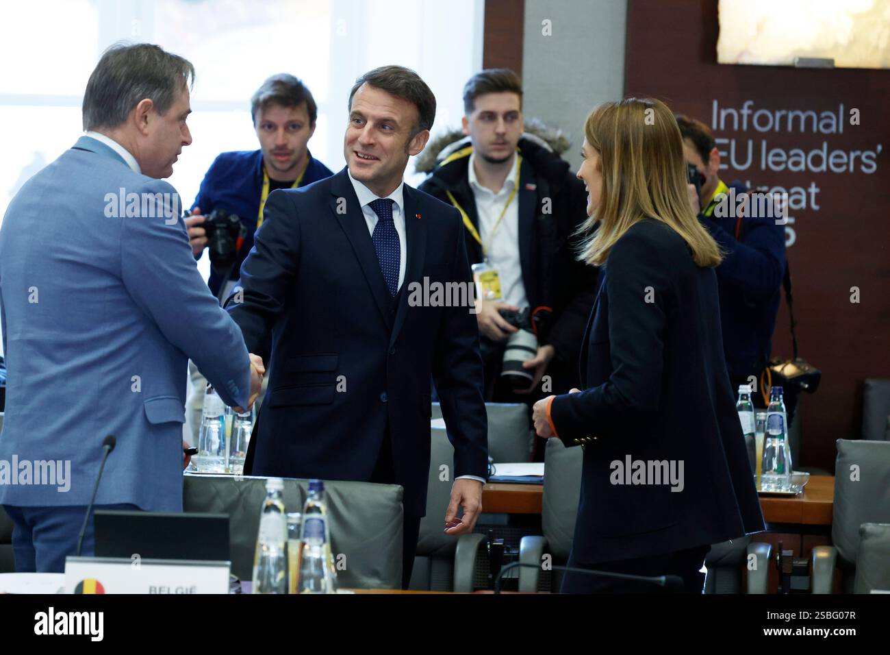 French President Emmanuel Macron, center, shakes hands with Belgium's ...