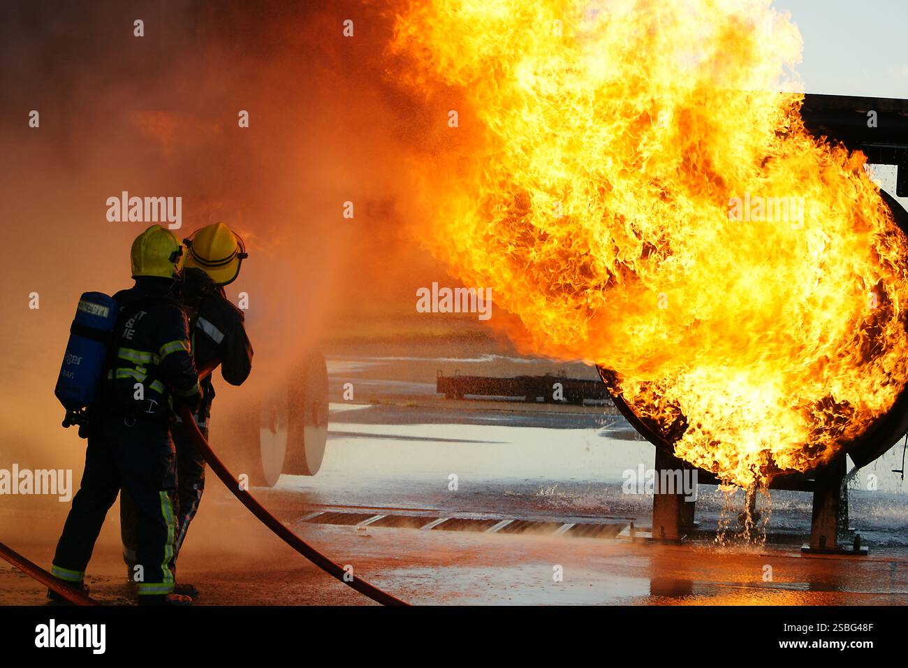 Aircraft engine fire at airport, airport emergency Stock Photo - Alamy