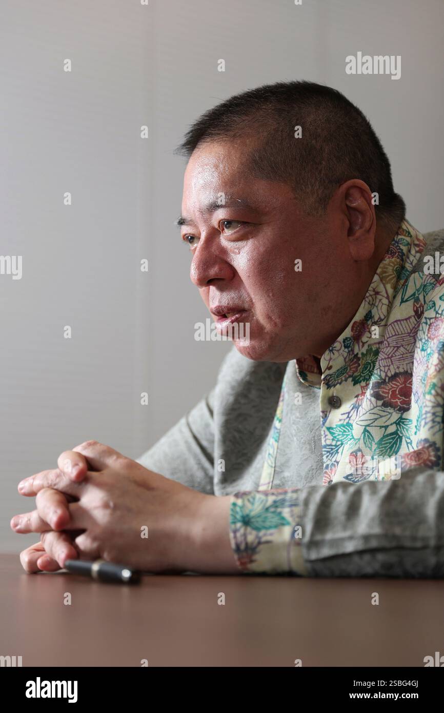 Japanese Author and former Foreign Ministry official Masaru Sato poses for photo during an ...