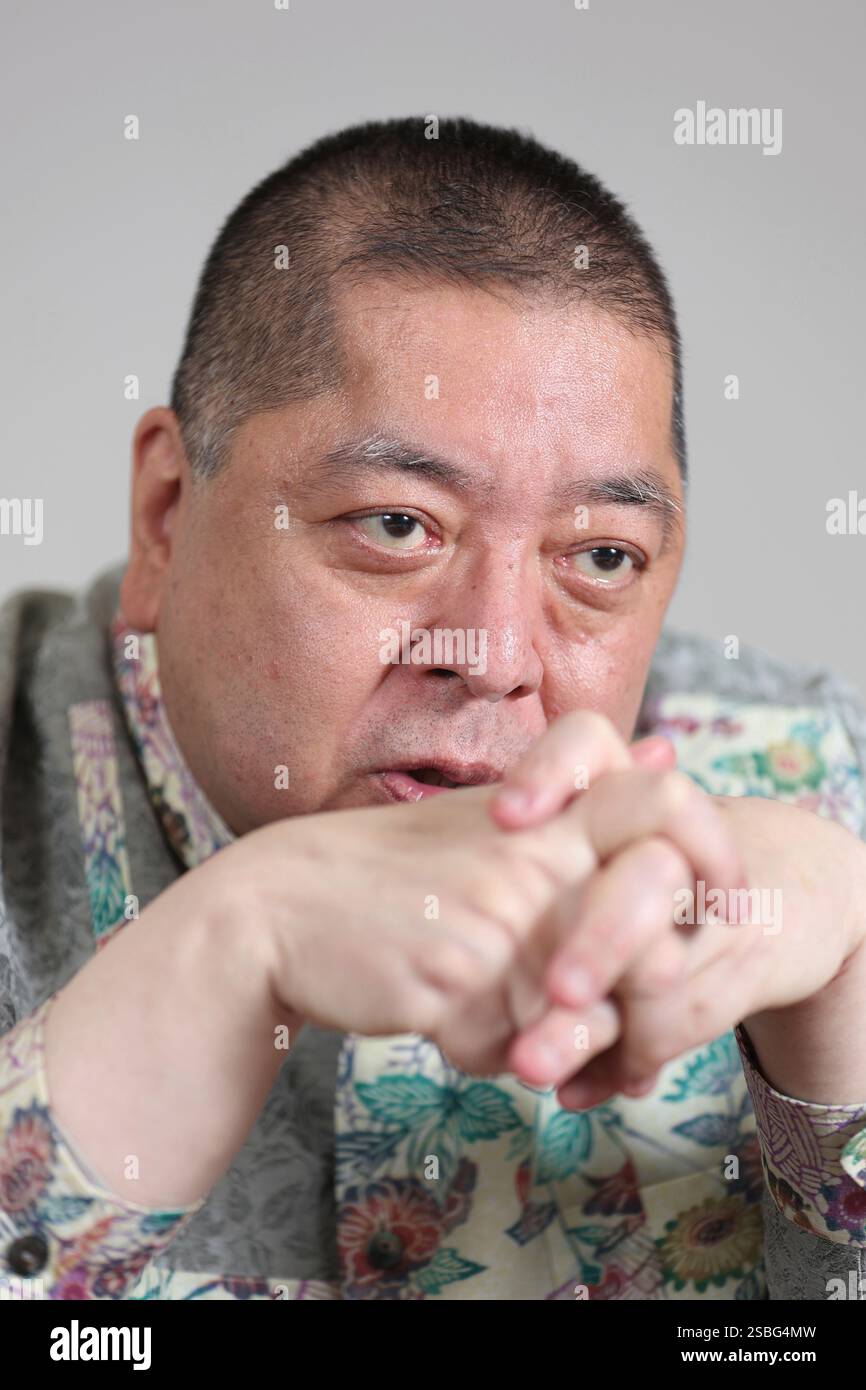 Japanese Author and former Foreign Ministry official Masaru Sato poses for photo during an ...