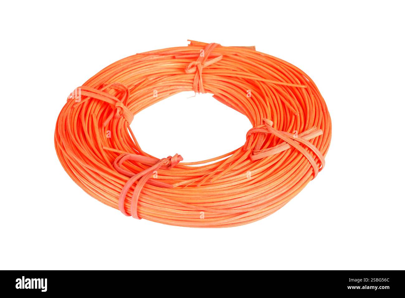 A decorative skein of orange rattan rods ideal for floral arrangements ...