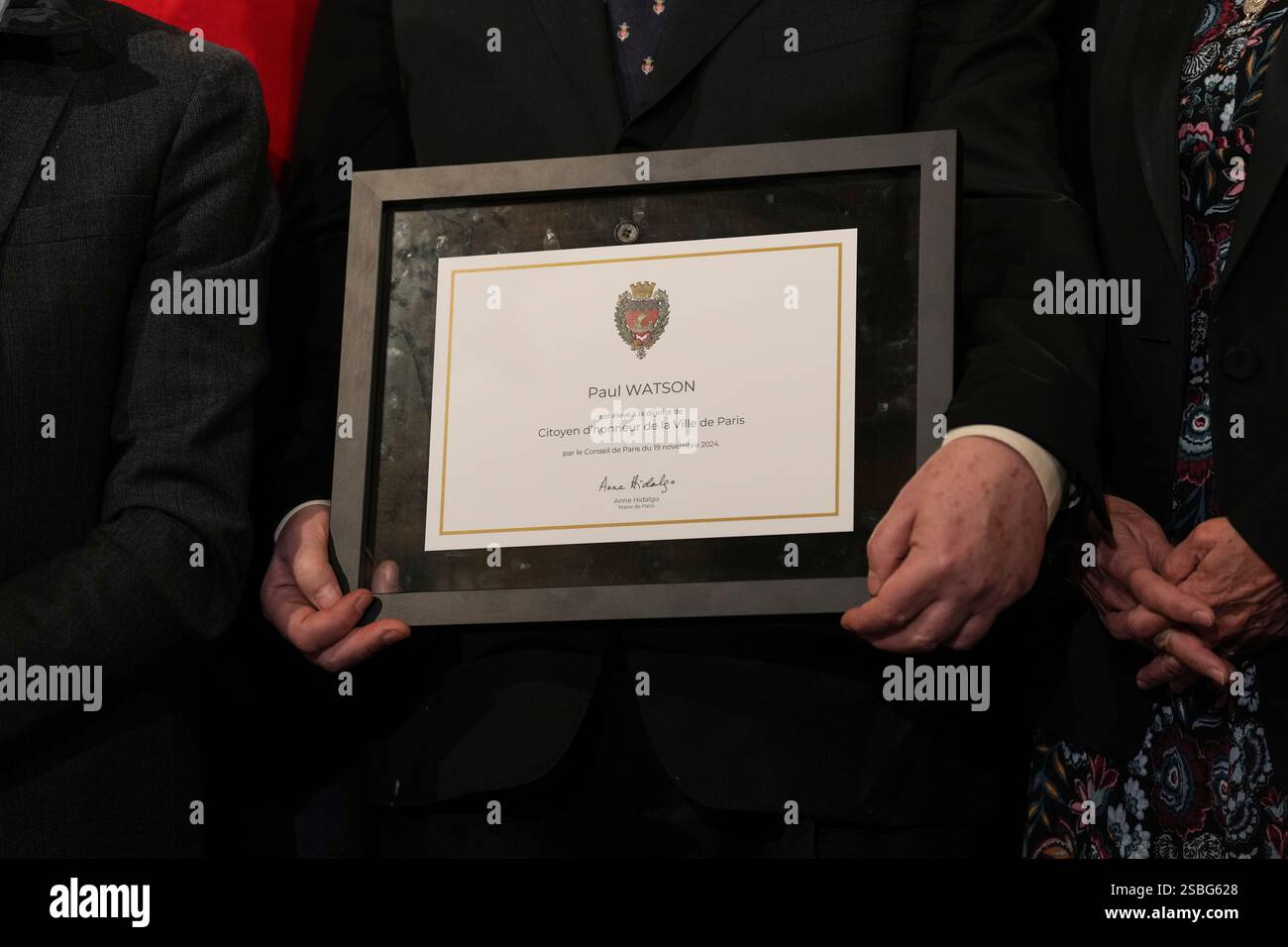Sea Shepherd founder Paul Watson holds the declaration of honorary ...