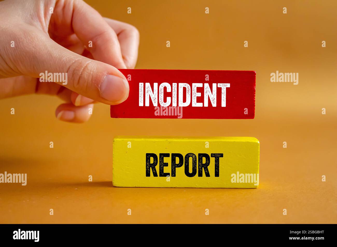 Incident report message written on wooden blocks on brown background ...