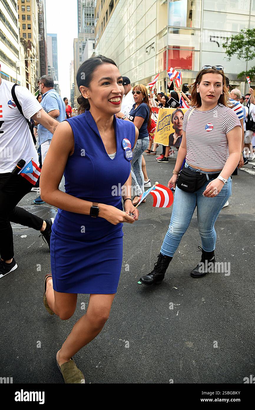 Alexandria Ocasio-Cortez marching in the National Puerto Rican Day ...
