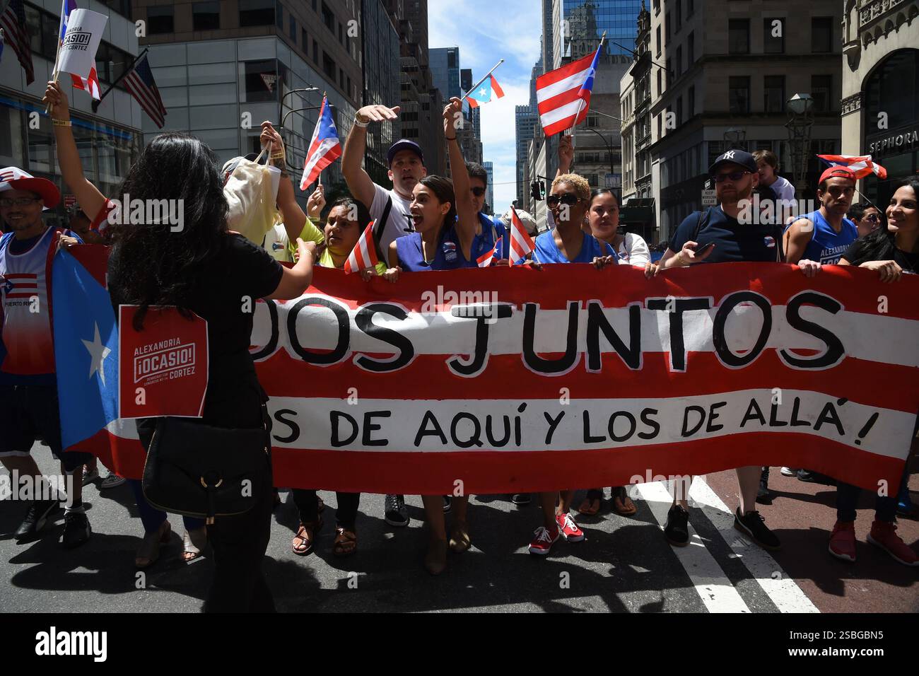Alexandria Ocasio-Cortez marching in the National Puerto Rican Day ...