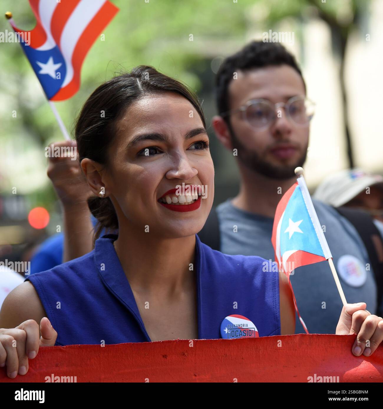 Alexandria Ocasio-Cortez marching in the National Puerto Rican Day ...