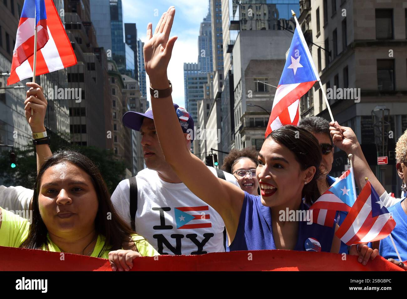 Alexandria Ocasio-Cortez marching in the National Puerto Rican Day ...