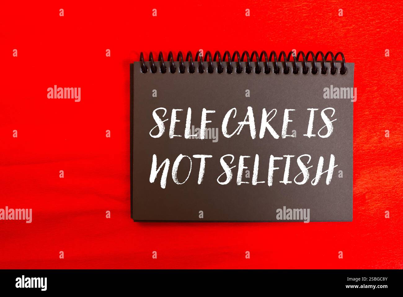 Self care is not selfish message written on black notebook page on red ...