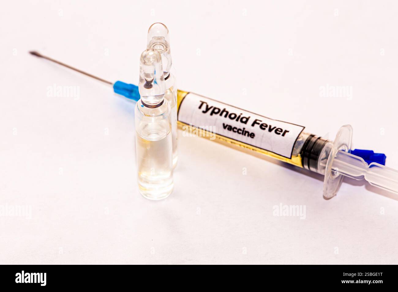Picture on a white background with a syringe full of typhoid fever ...