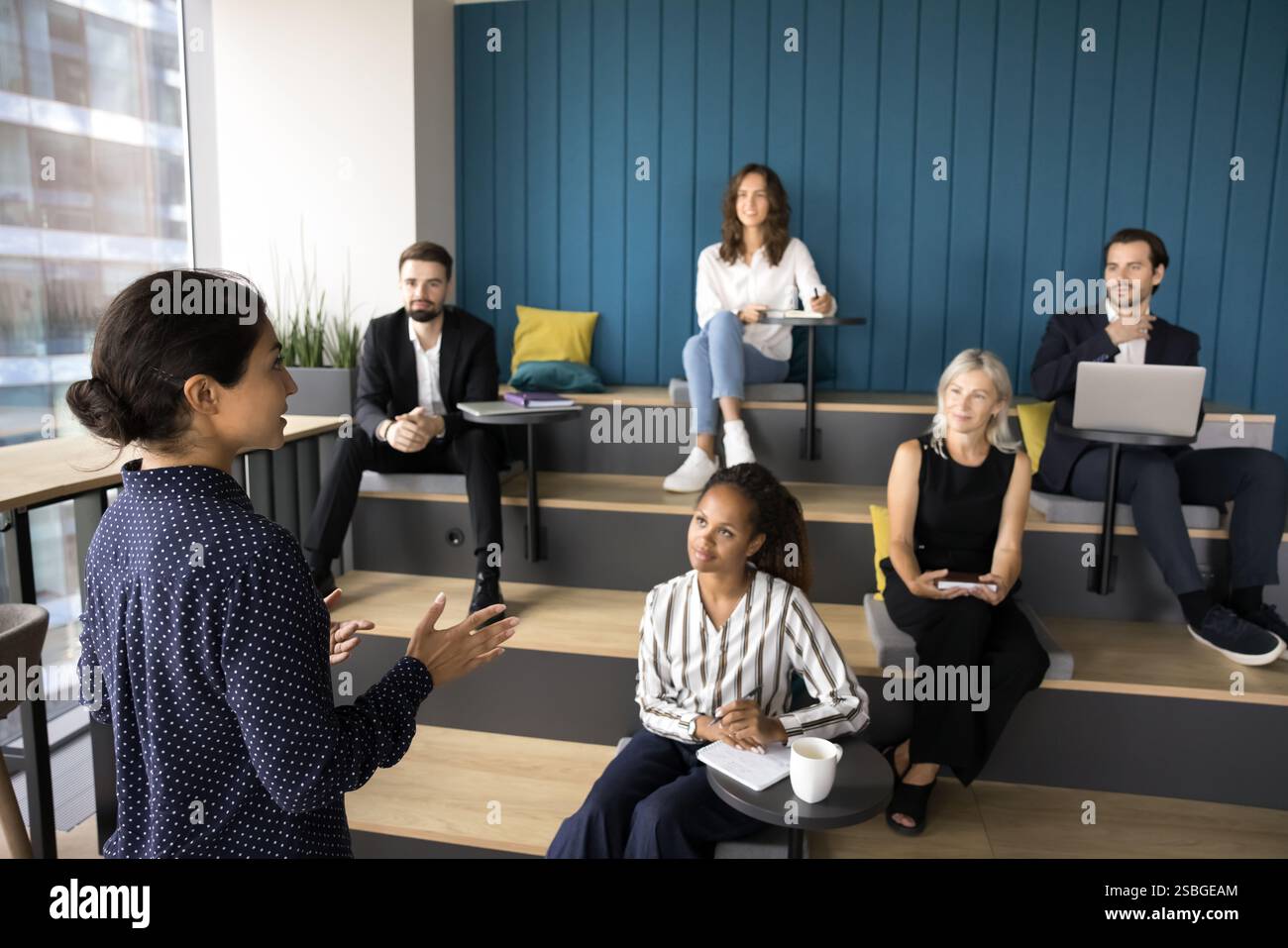 Pretty Indian presenter make speech stand in front of audience Stock ...