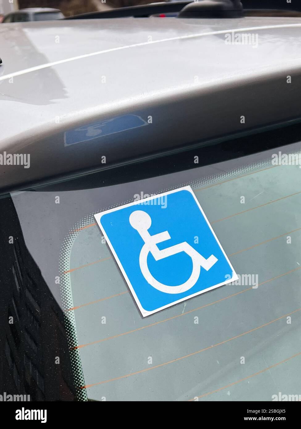 Accessible parking sign on a car, emphasizing inclusivity and ...