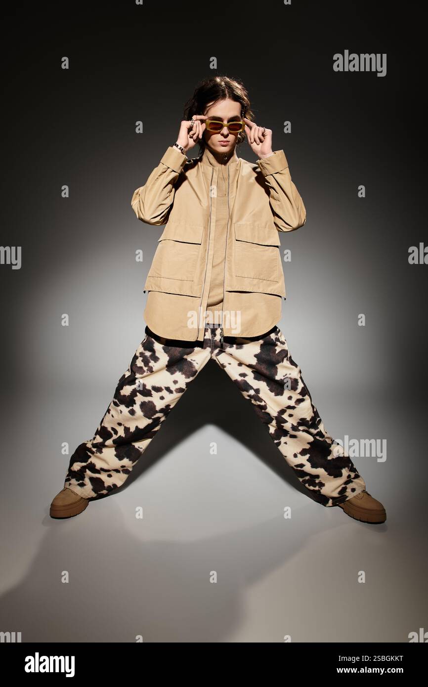 A handsome young man stands confidently, sporting a unique outfit with ...