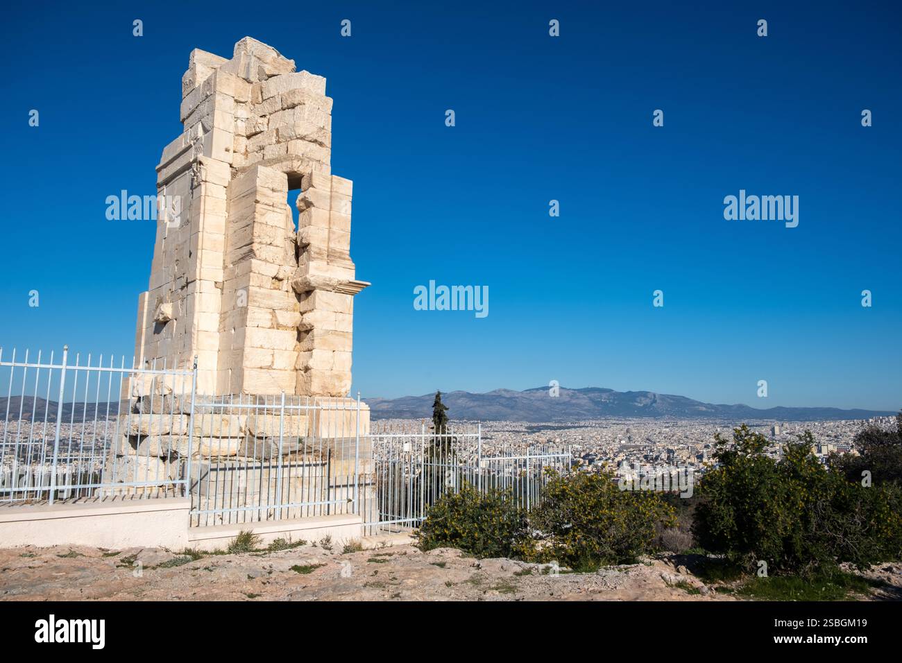 Athens, Greece, Philopappos Monument up on the hill, blue sky ...