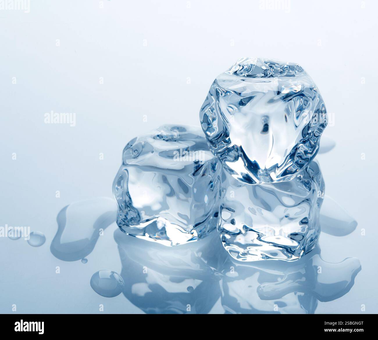Melted ice cubes on white background Stock Photo - Alamy