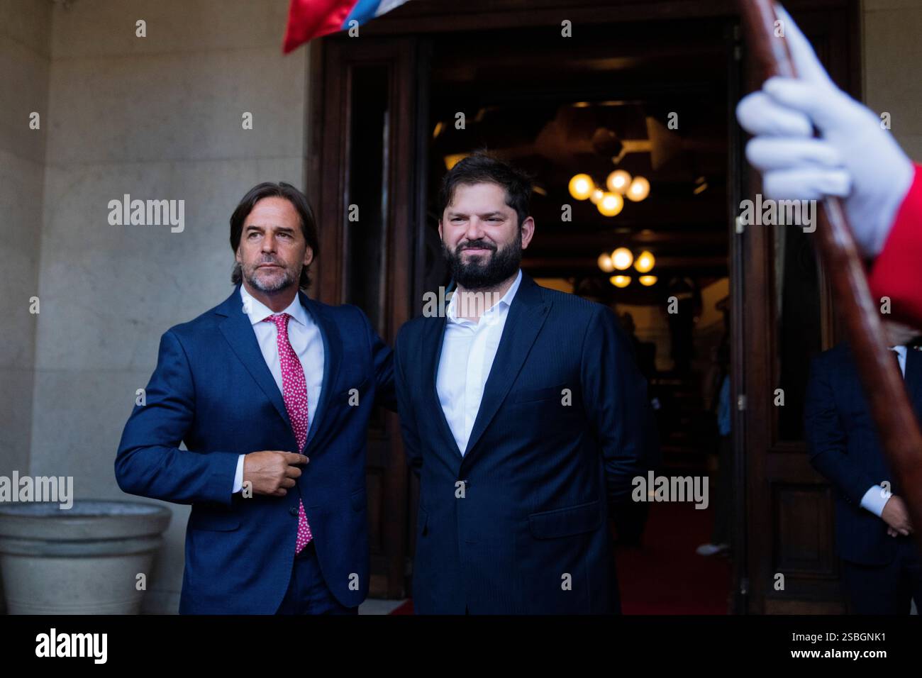 Chile's President Gabriel Boric, right, stands with Uruguayan President ...