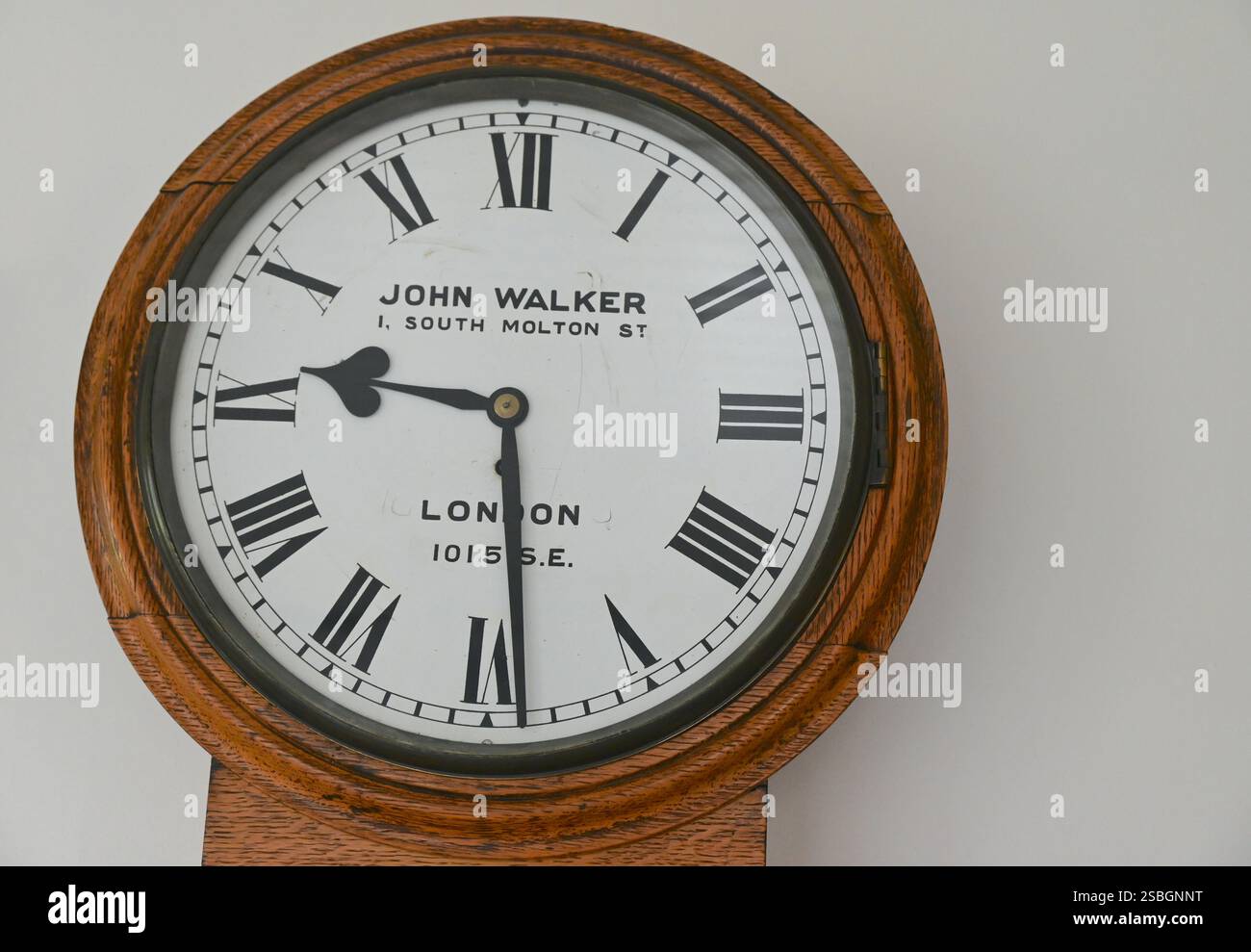 Vintage round clock London make John Walker on light background Stock ...
