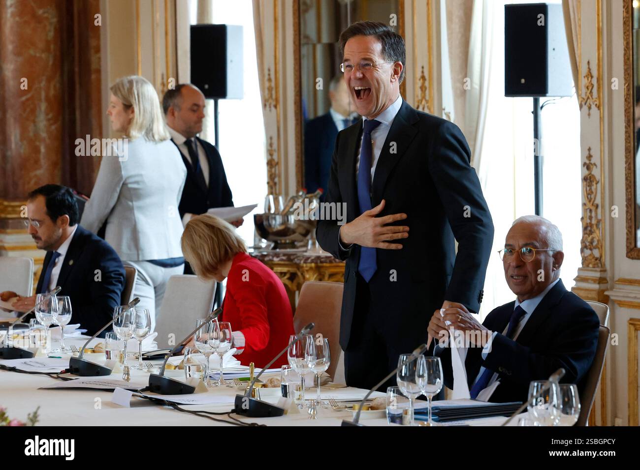 NATO Secretary General Mark Rutte addresses minsters on the other side of the room during an EU ...