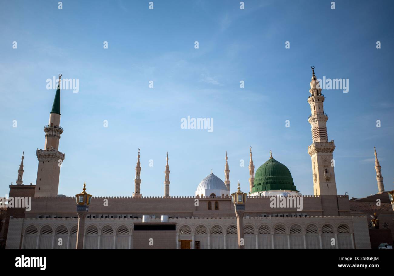 A green dome and minarets in Prophet Mosque in Madinah, also known as ...