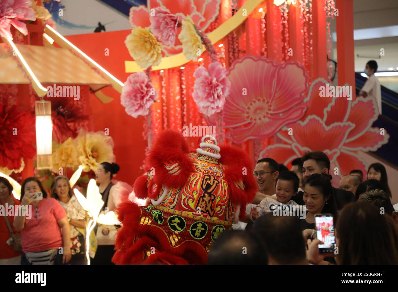 A lion dance performance on stilts at City Square shopping mall in Johor Bahru, Malaysia Stock ...