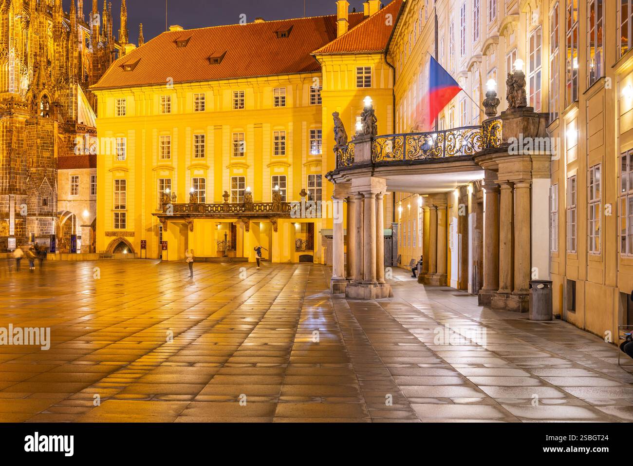 At dusk, the entrance door of Prague Castle showcases its impressive ...