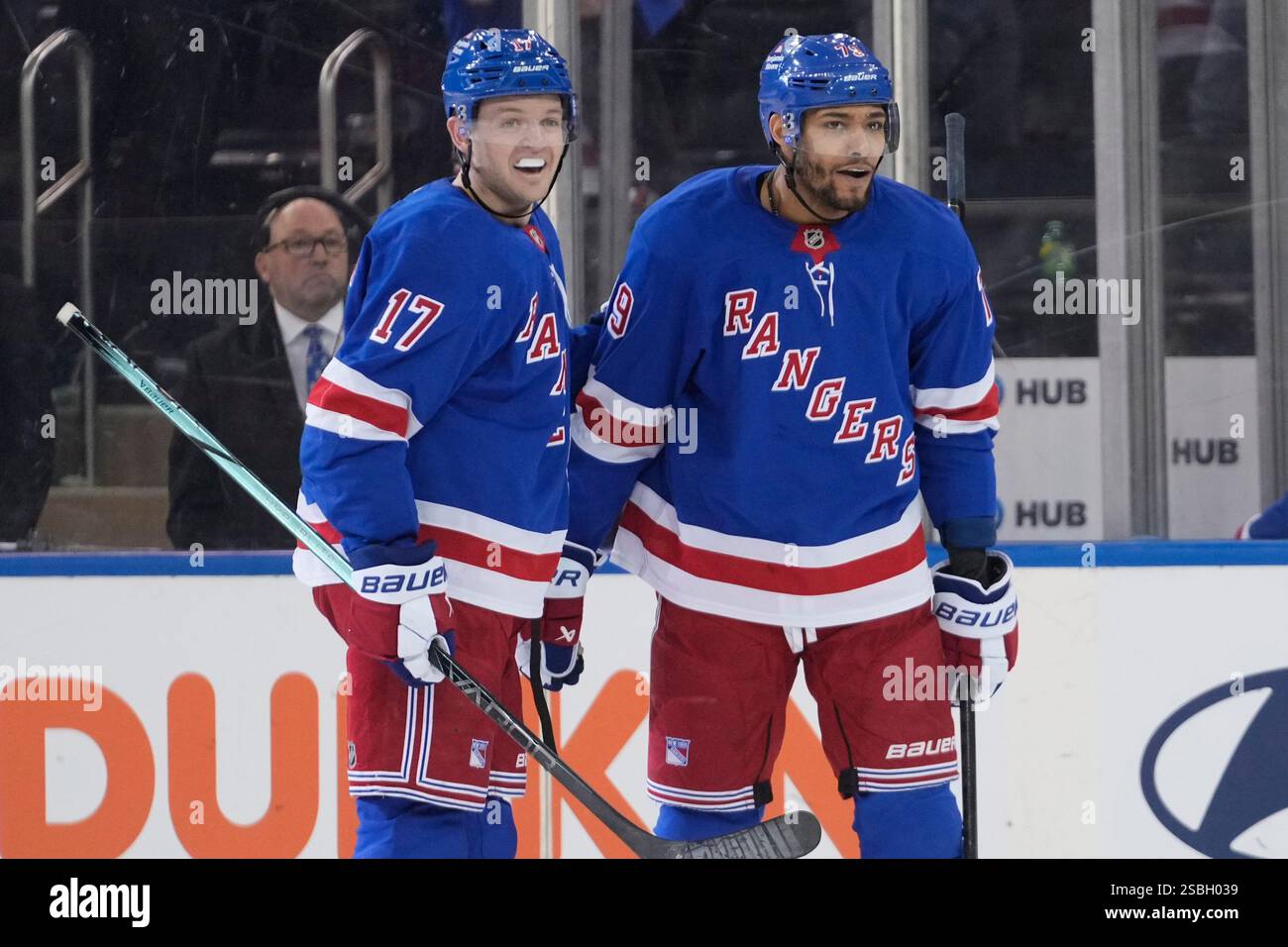 New York Rangers defenseman K'Andre Miller (79) celebrates with Will ...
