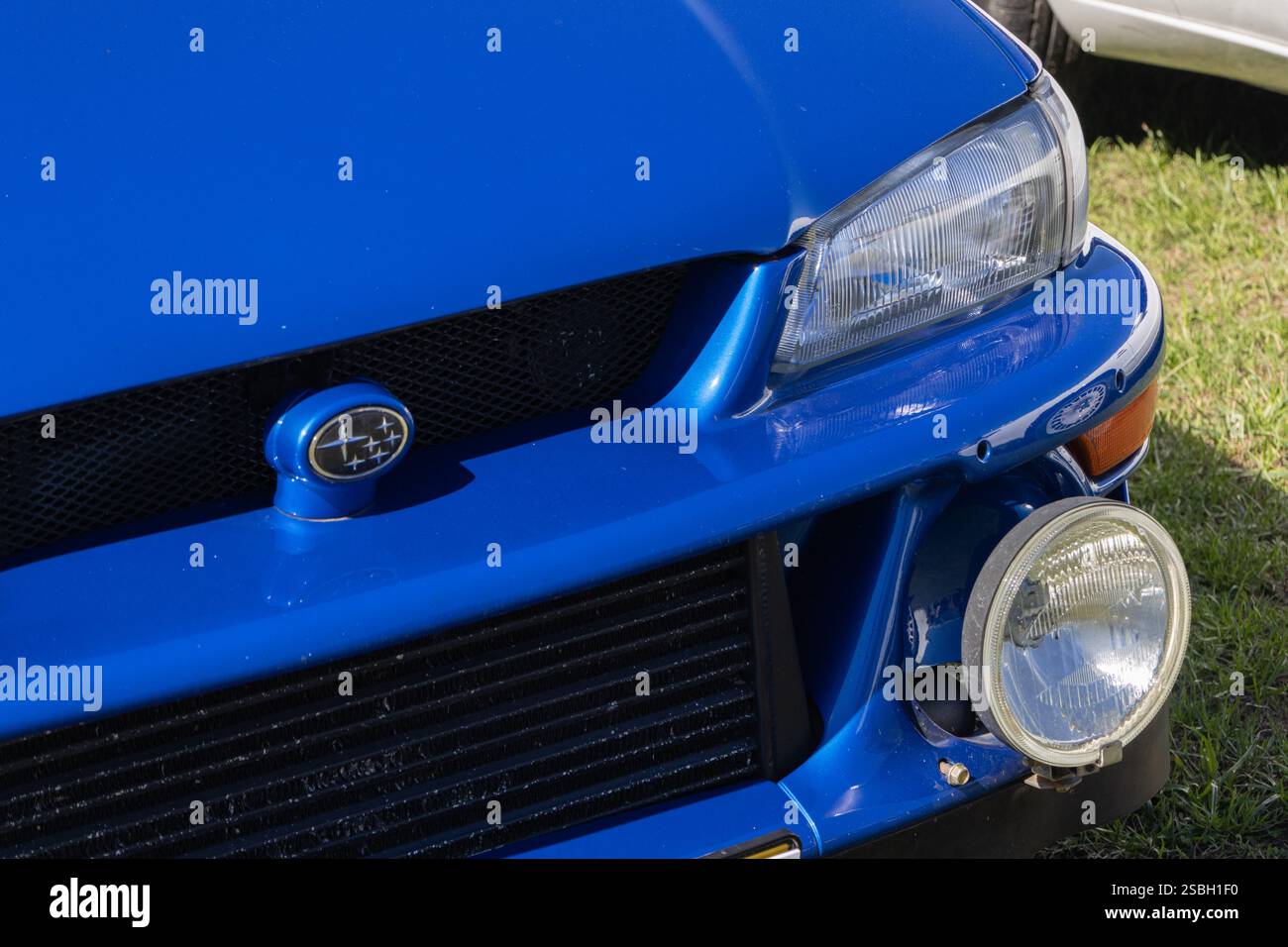 Close up of a blue subaru impreza wrx sti version v, highlighting the ...