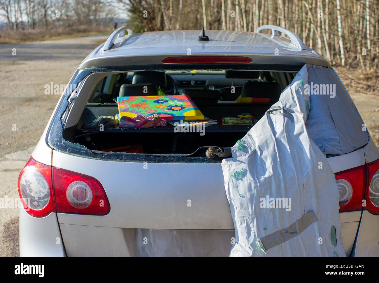 Rear window of a car smashed due to vandalism symbol image Stock Photo ...