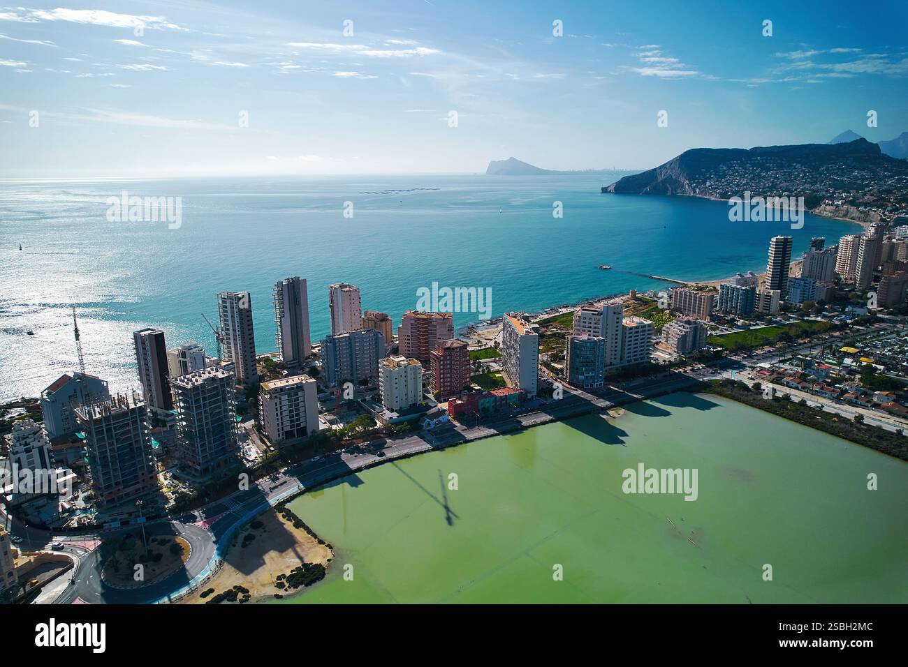 Aerial shot of Calpe cityscape. Costa Blanca, Spain. Coastal town with ...