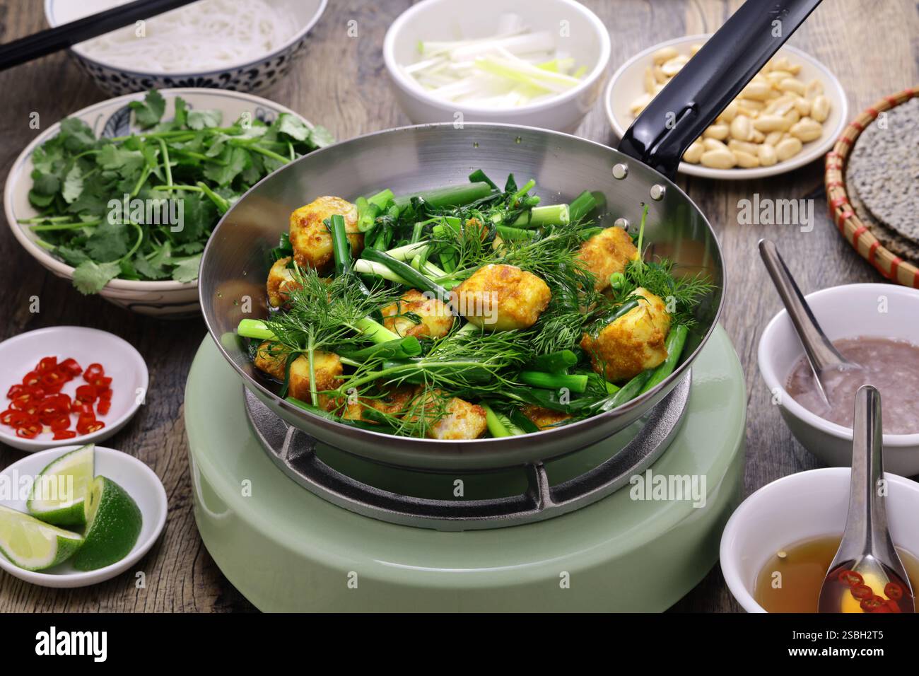 Cha Ca La Vong, a specialty dish from Hanoi, Vietnam. Marinated river ...