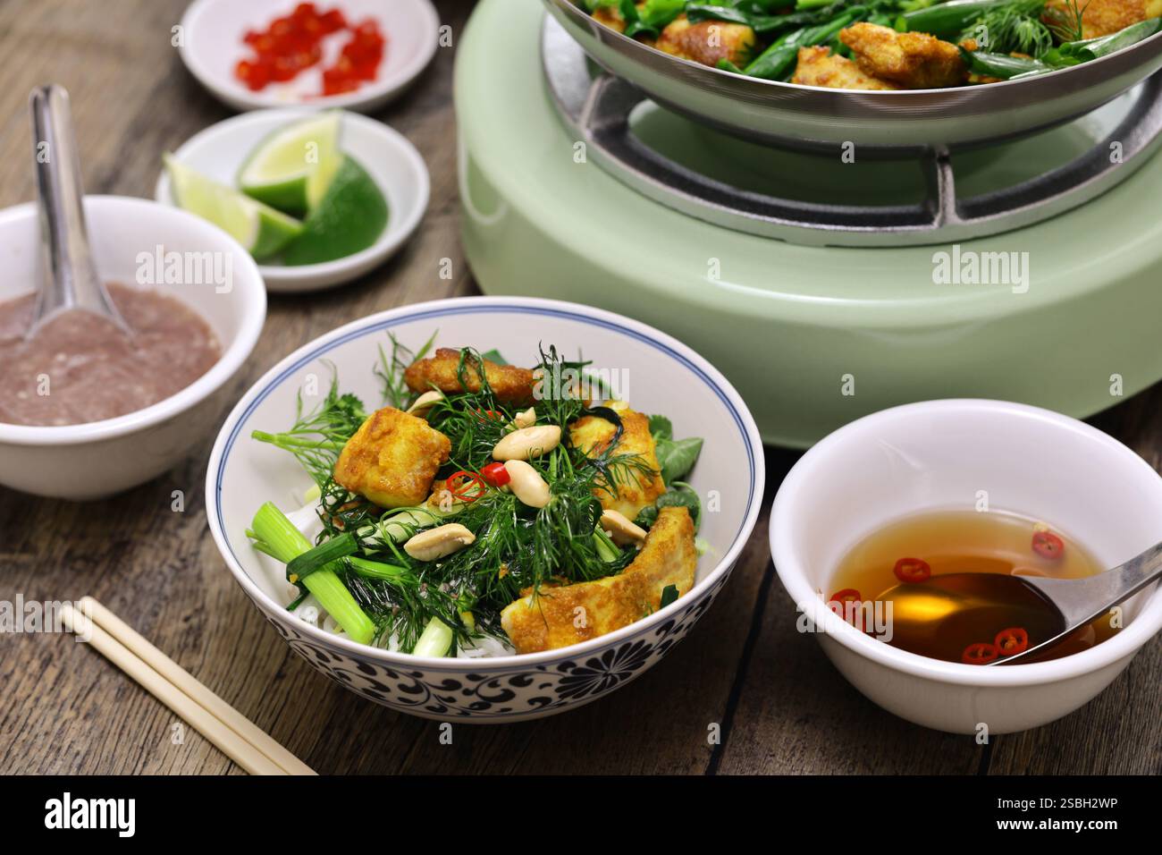 Cha Ca La Vong, a specialty dish from Hanoi, Vietnam. Marinated river ...