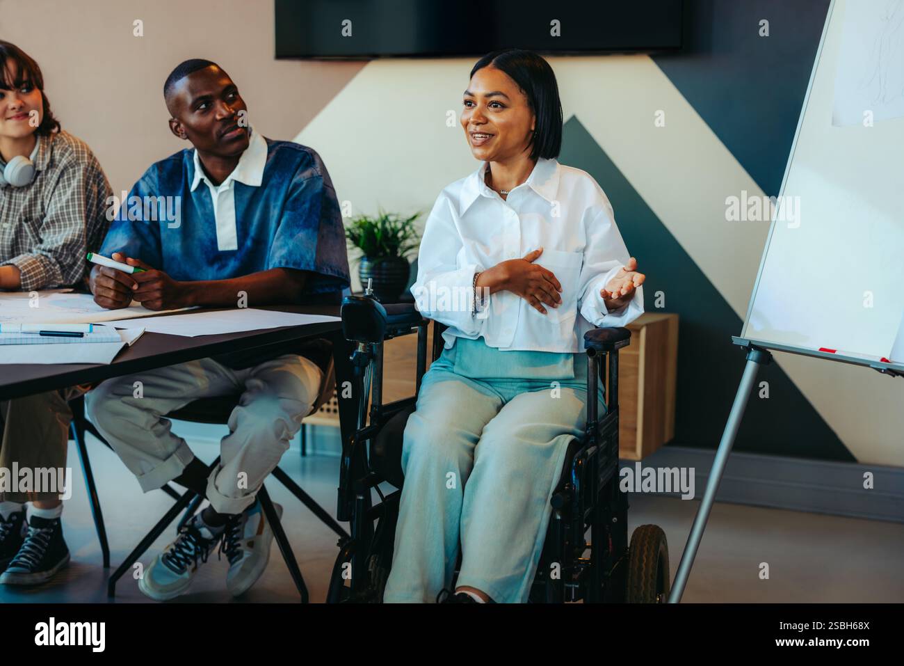 College students engage in a study session with a disabled peer ...