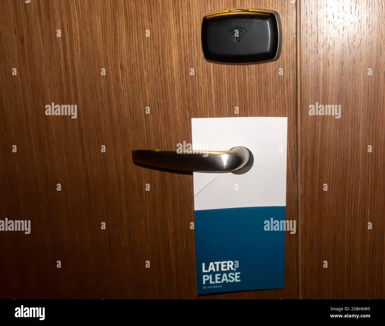 Sign on hotel door hanging "Later please do not disturb Stock Photo - Alamy