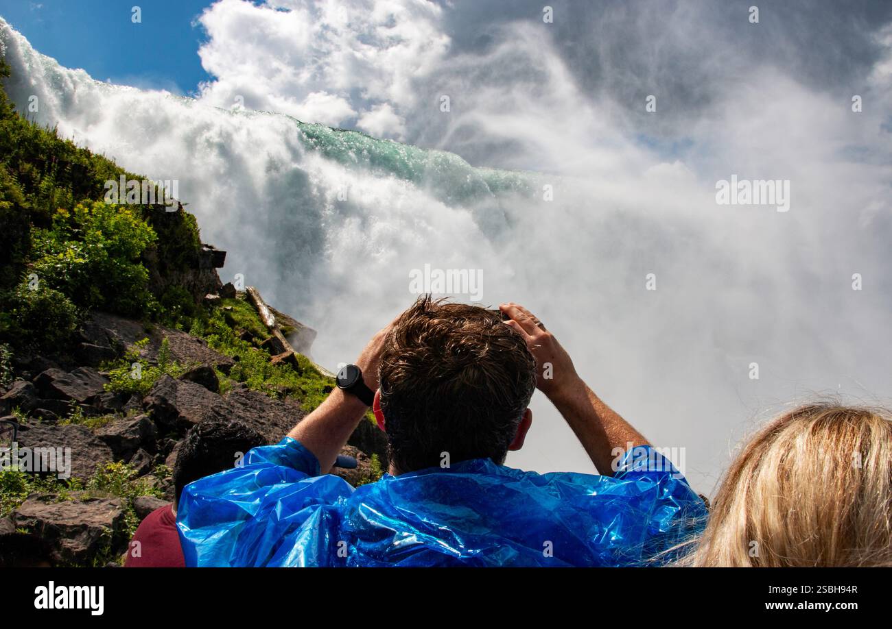 Tourists explore the power of Niagara Falls, capturing the mesmerizing ...