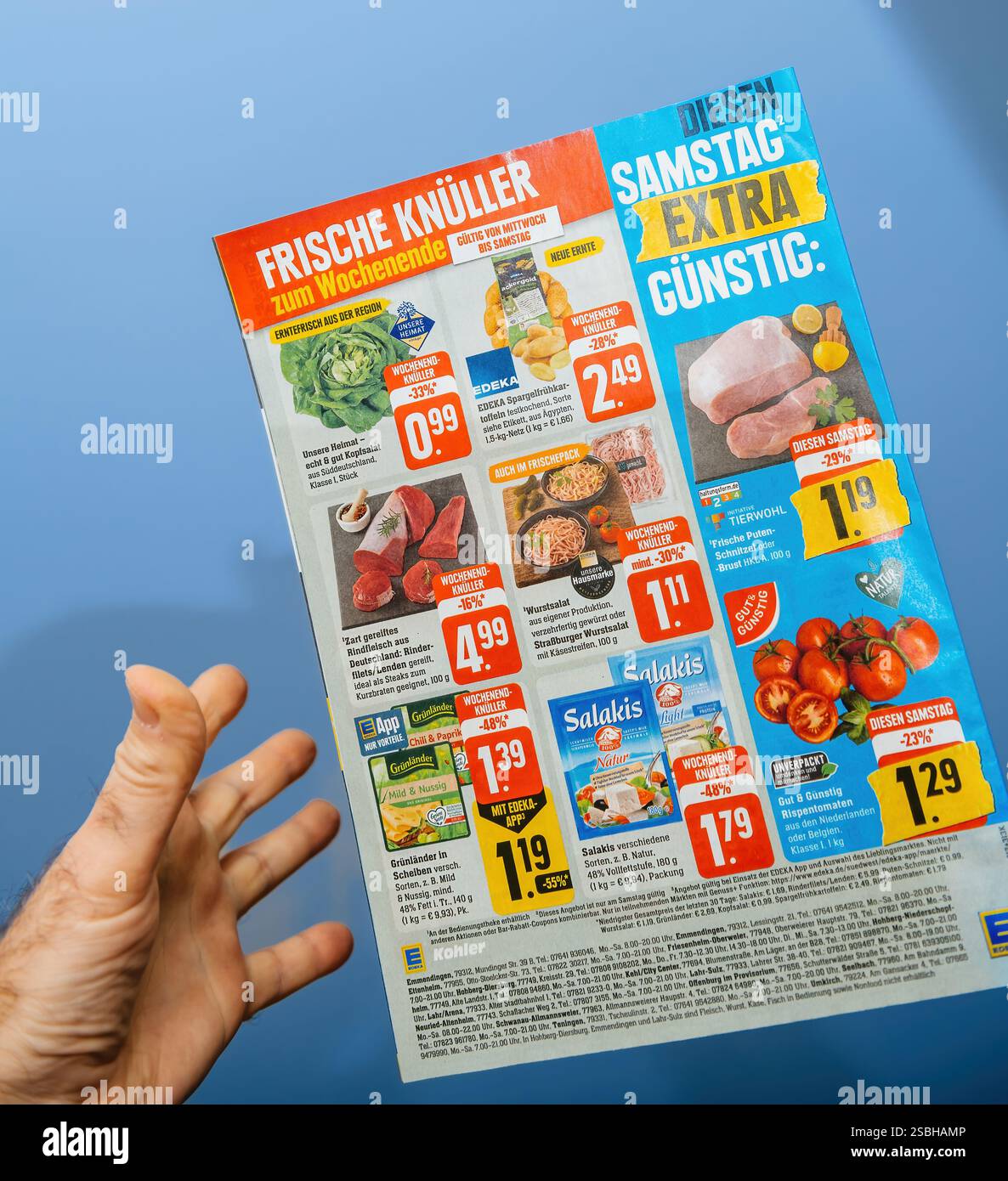 Paris, France - Jan 10, 2025: A hand holds a colorful grocery ...