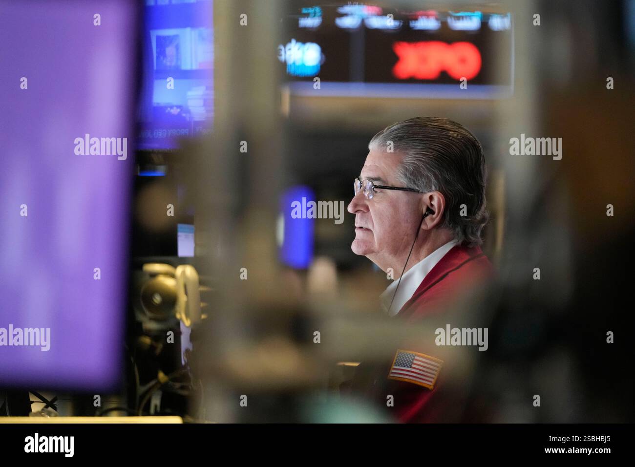 Traders work on the floor at the New York Stock Exchange in New York ...